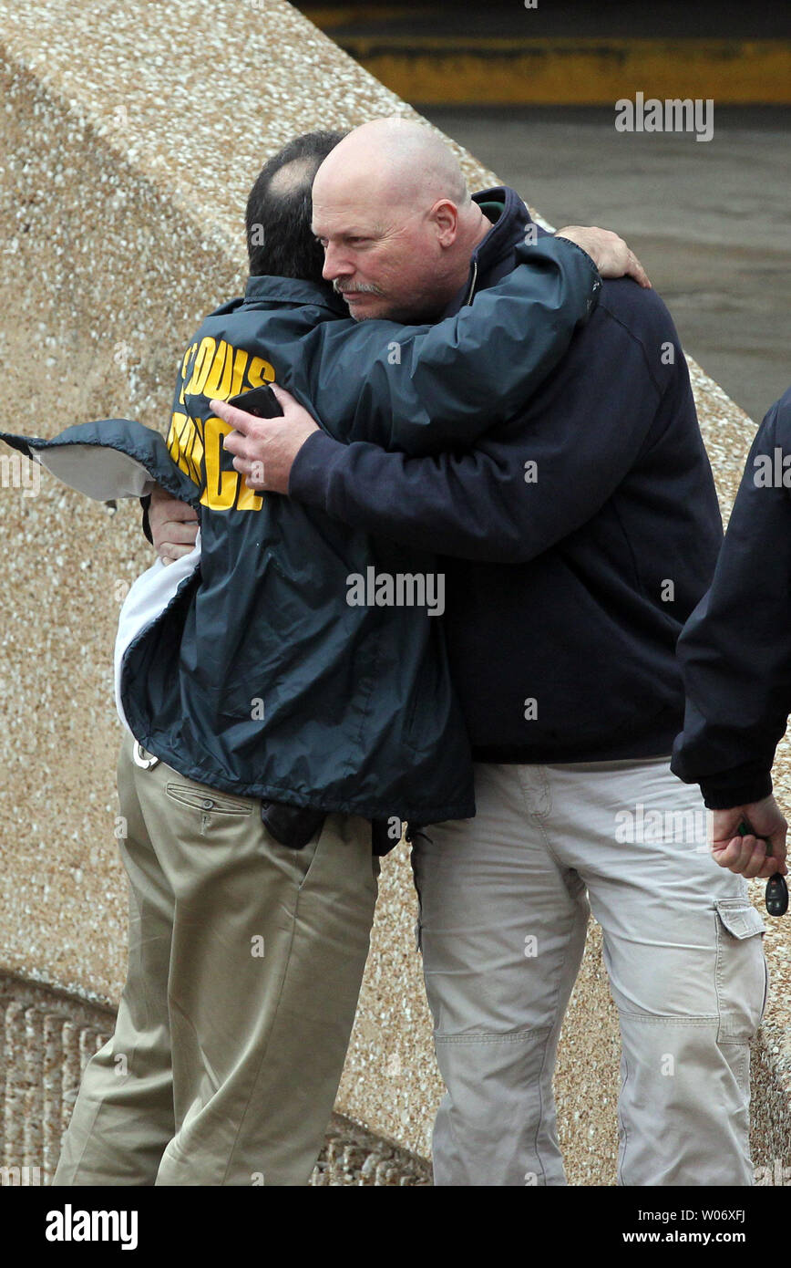 Two police officers hug in hi-res stock photography and images - Alamy