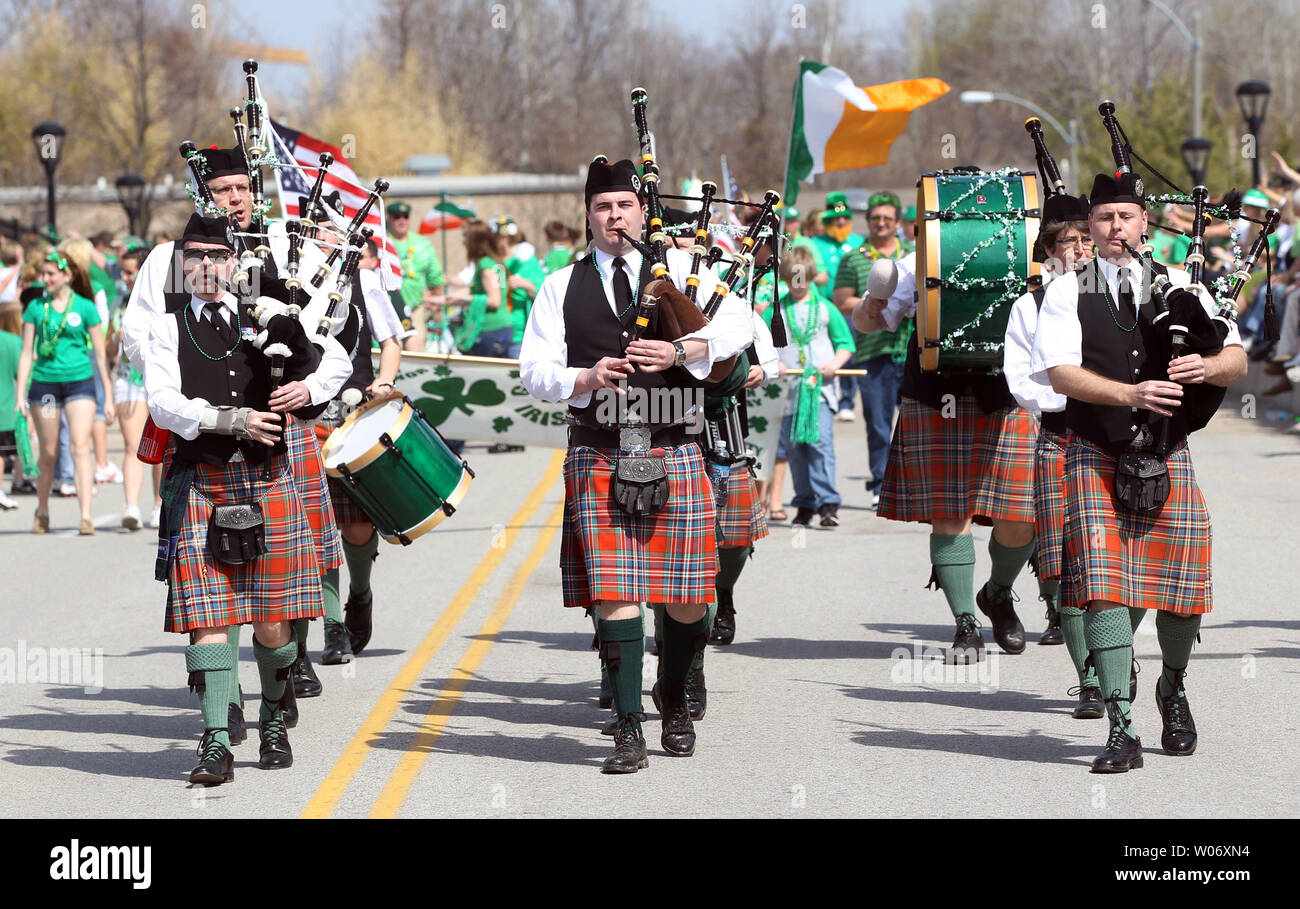 Members of the Saint Louis Caledonian Pipe Band, play and march during ...
