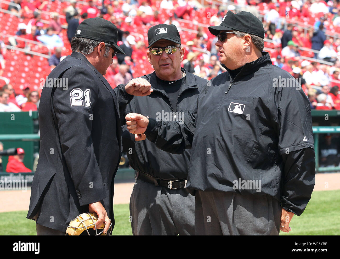 Umpires Jerry Layne (R) and Bob Davidson pound the chest protector of ...