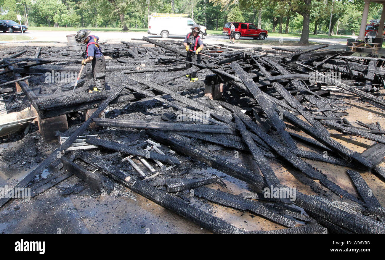 St. Louis firefighters dig through the rubble of a historic bandstand ...