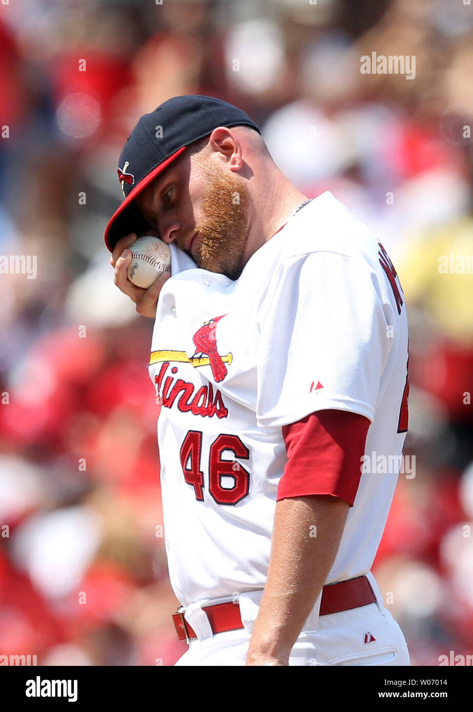 St. Louis Cardinals starting pitcher Kyle McClellan wipes his face in ...