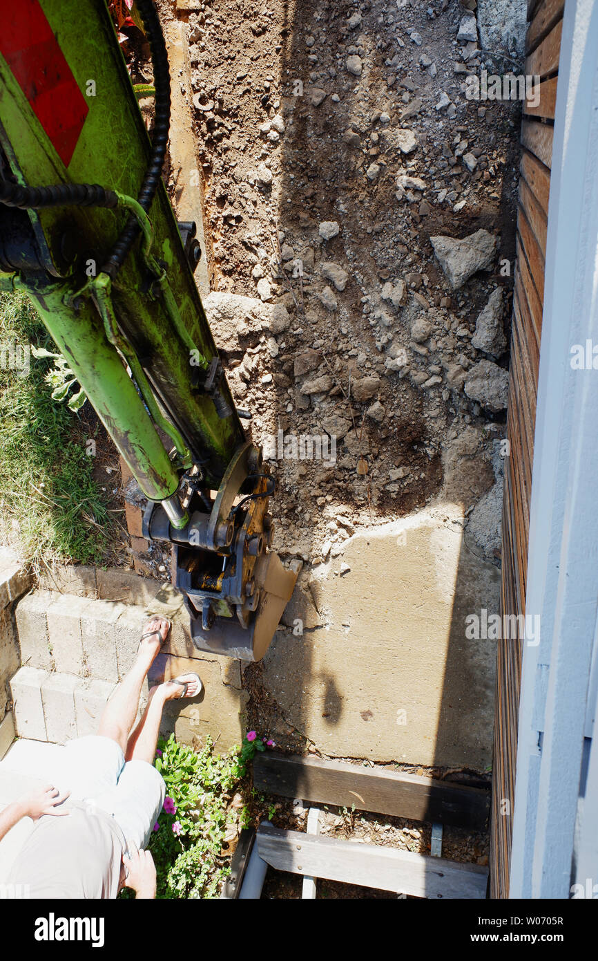 EXCAVATOR BREAKING UP CONCRETE Stock Photo - Alamy