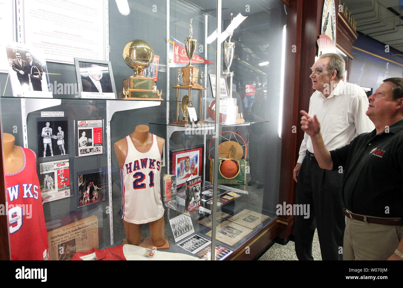 Greg Maracek president of the St. Louis Sports Hall of Fame (R) shows ...