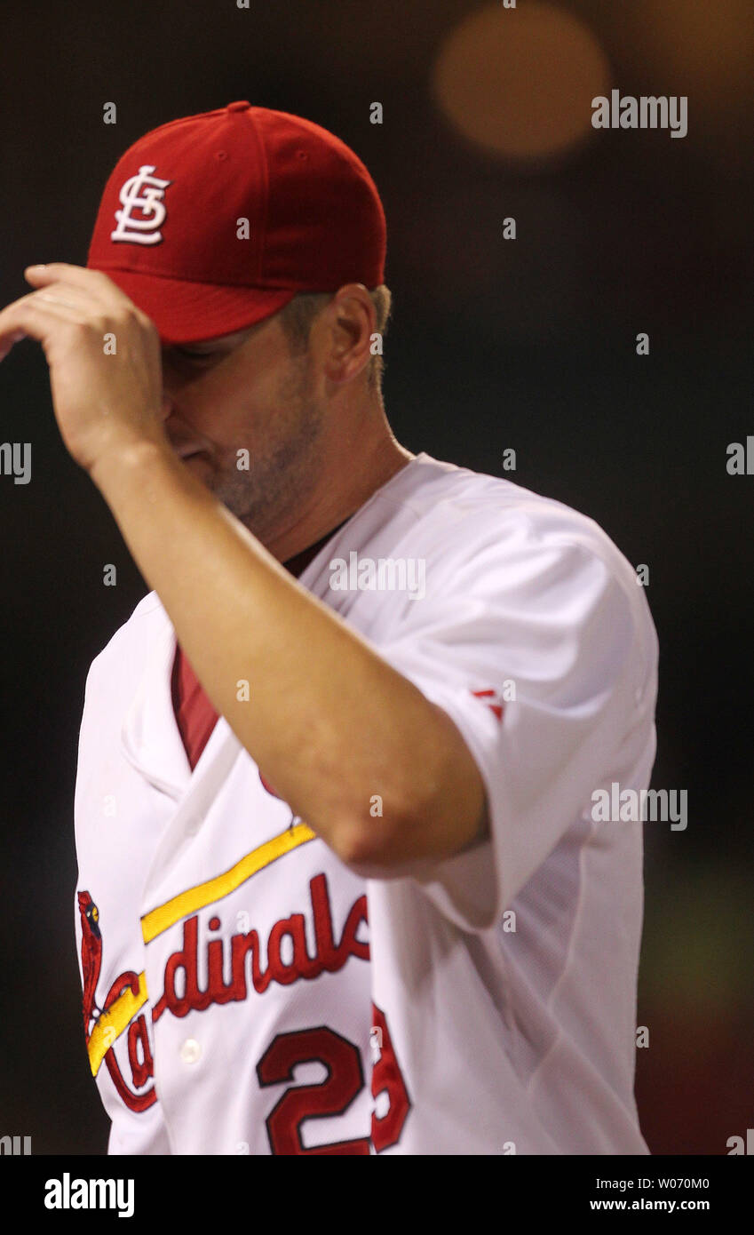 St. Louis Cardinals starting pitcher Chris Carpenter tips his cap to ...