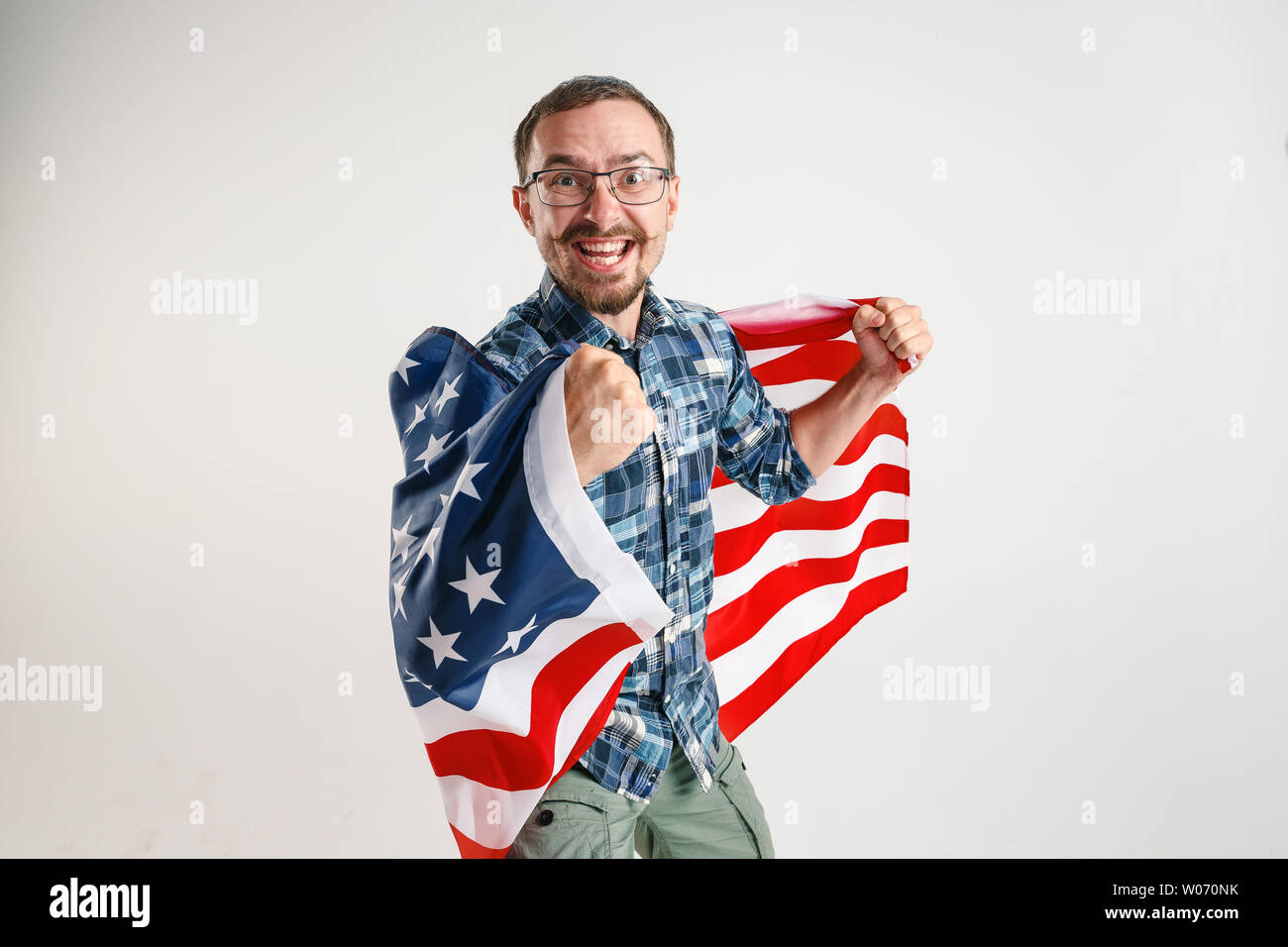 Celebrating an Independence day. Stars and Stripes. Young man with the ...