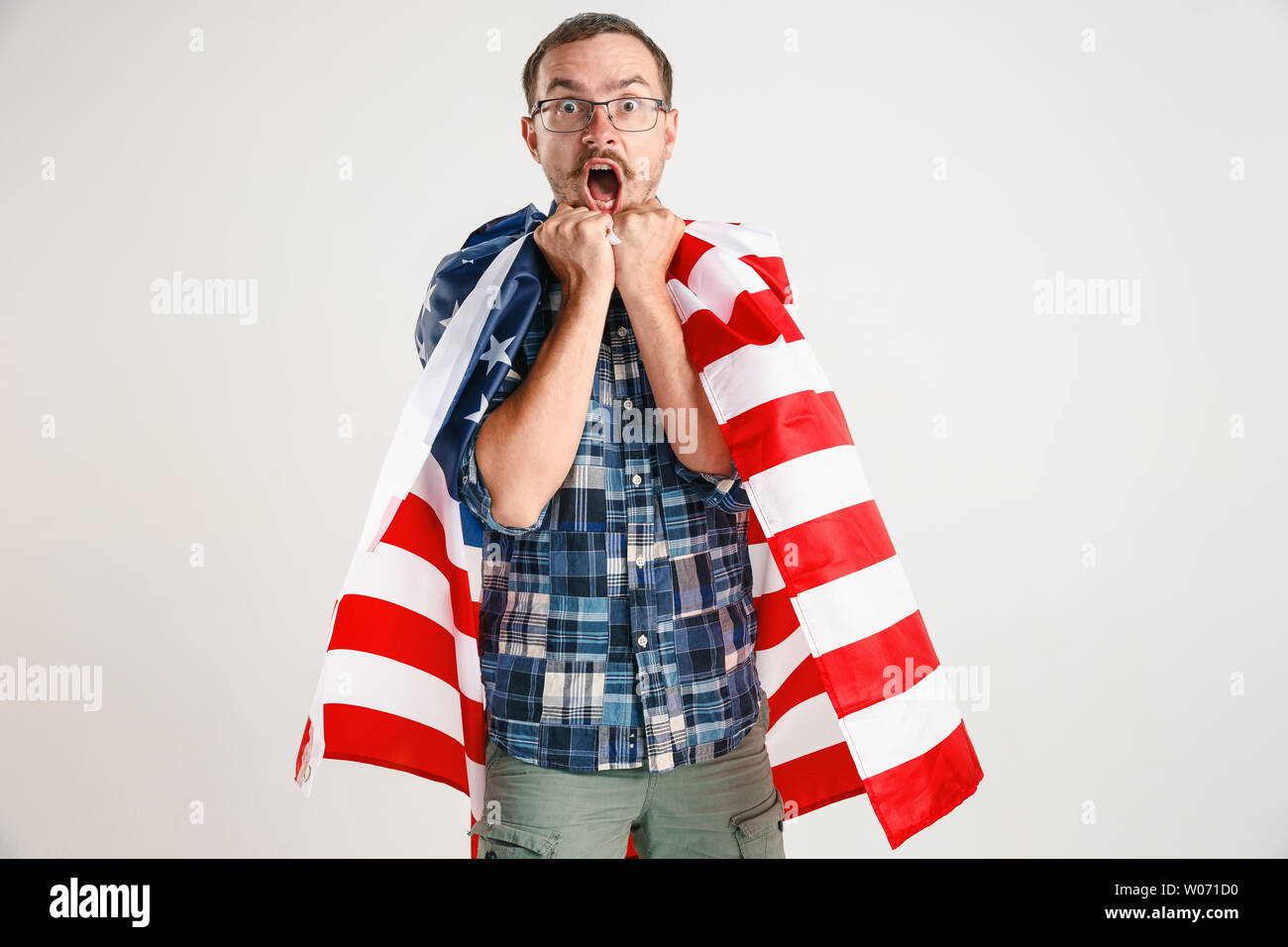 Celebrating an Independence day. Stars and Stripes. Young man with the ...