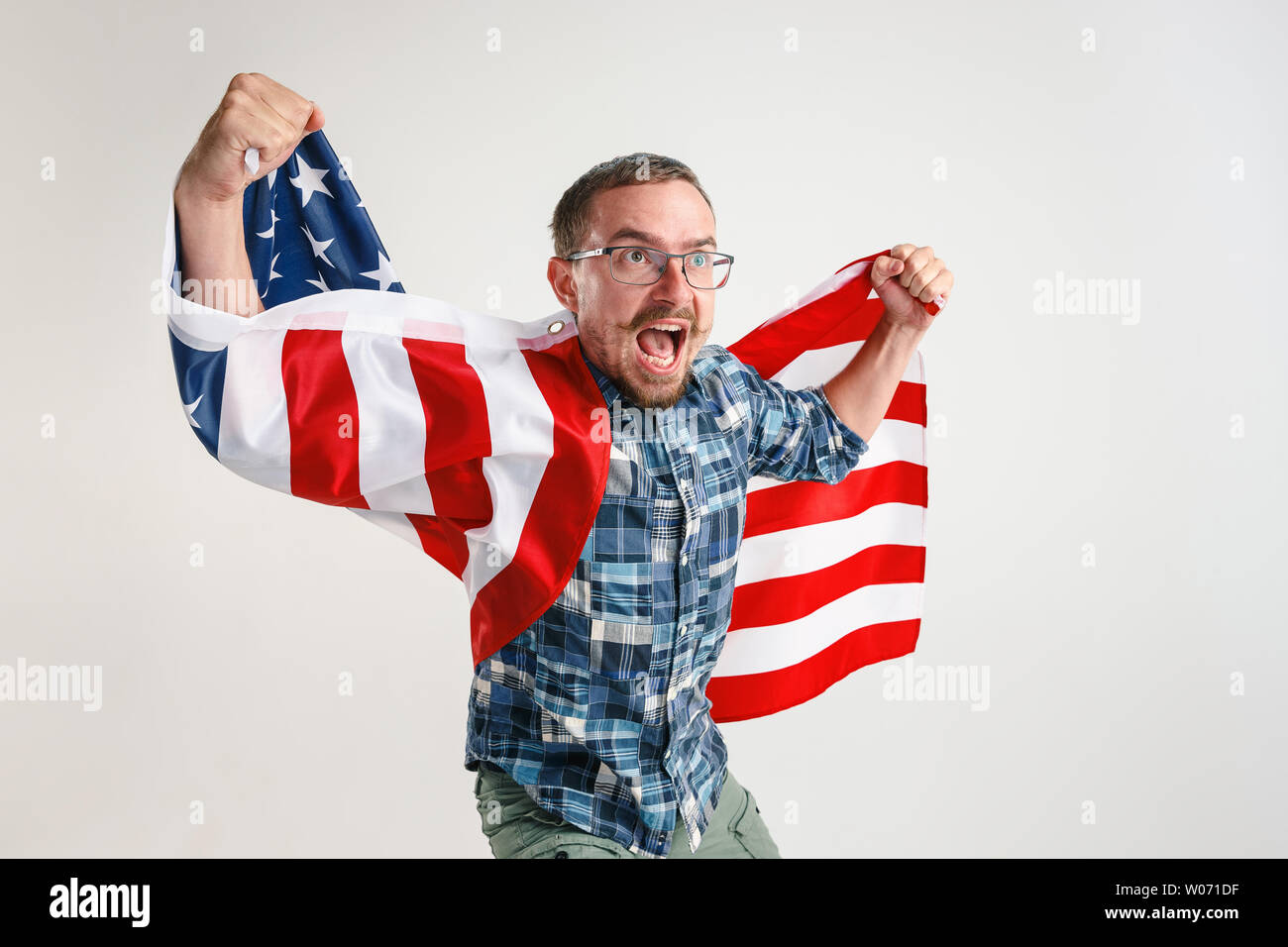Celebrating an Independence day. Stars and Stripes. Young man with the ...