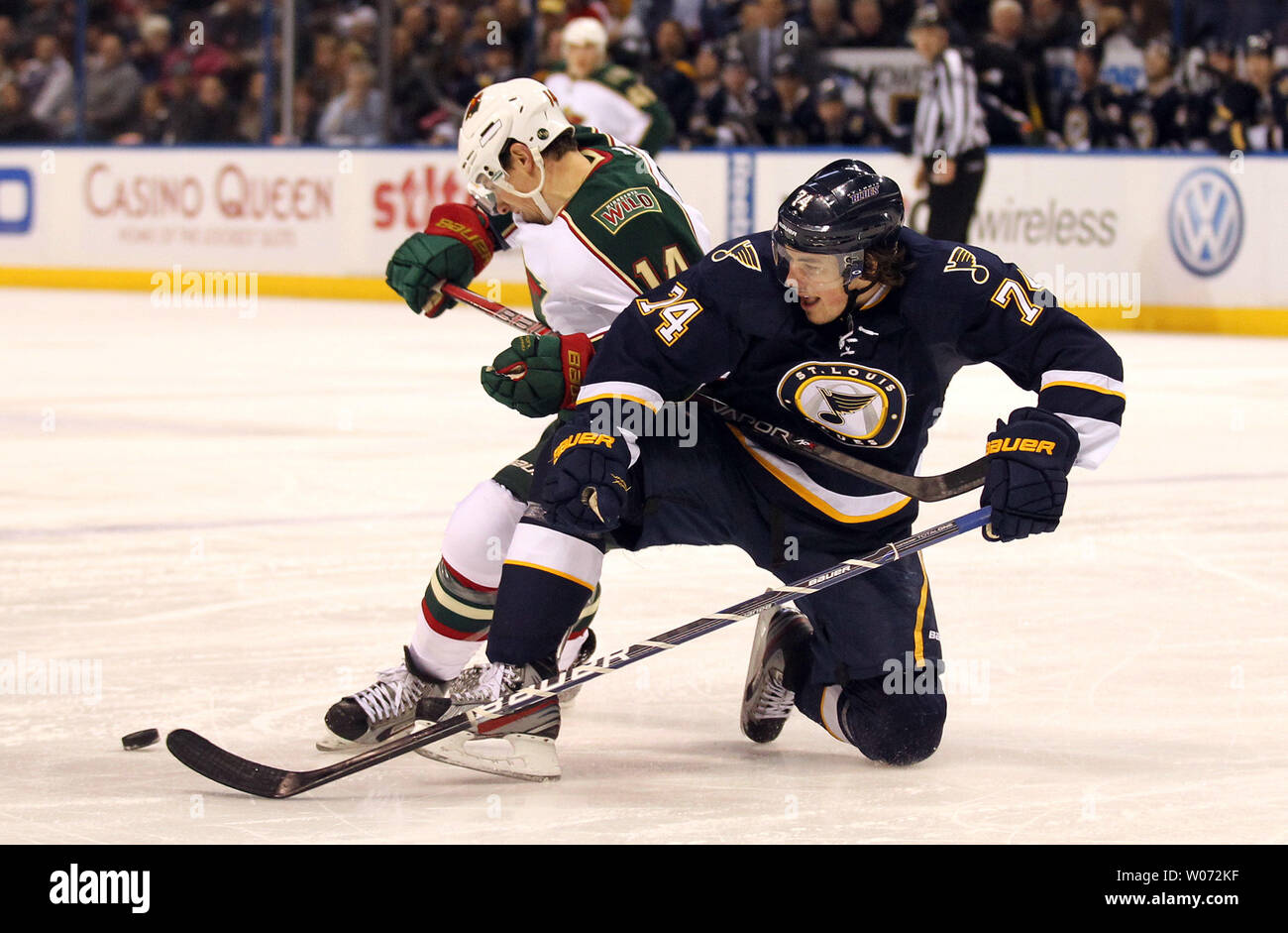St. Louis Blues T.J. Oshie and Minnesota Wild Darroll Powe pull each ...