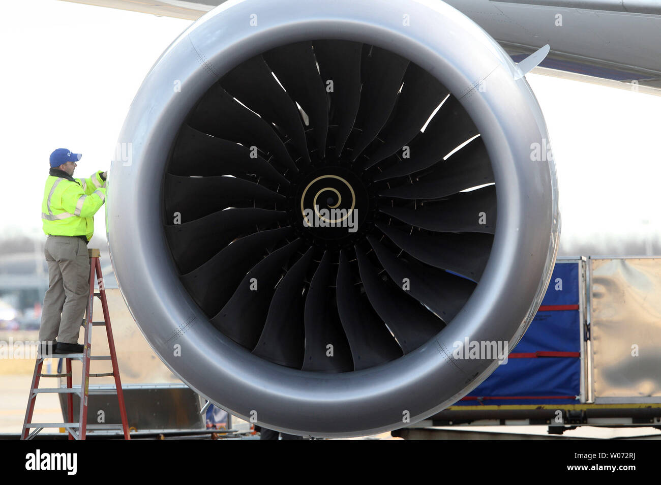 A mechanic inspects the engine of a Boeing 787 Dreamliner, after ...