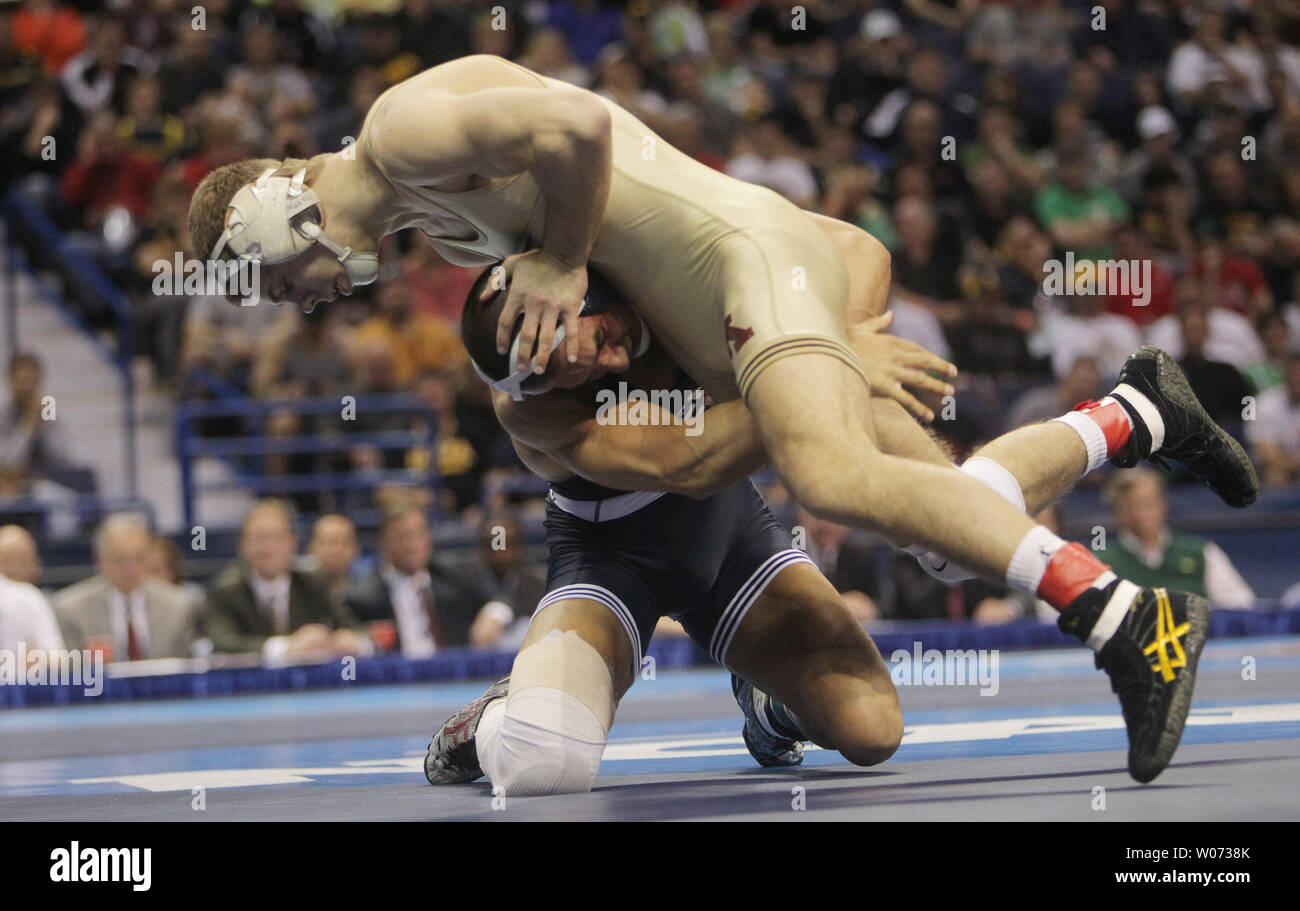 Frank Molinaro of Penn State University attacks the leg of Dylan Ness ...