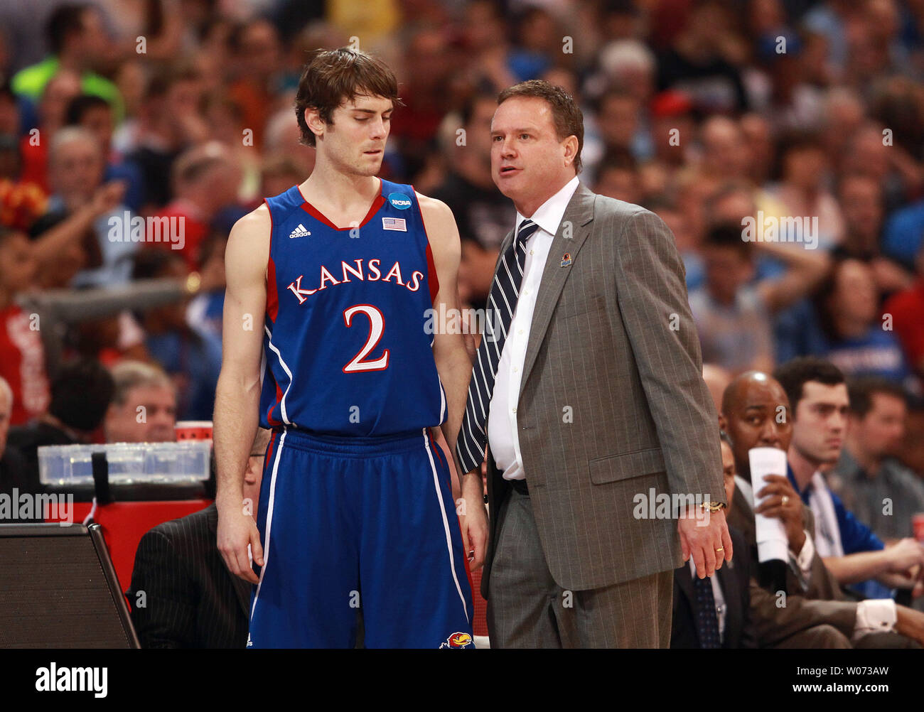 Kansas' head basketball coach Bill Self gives instructions to Conner ...