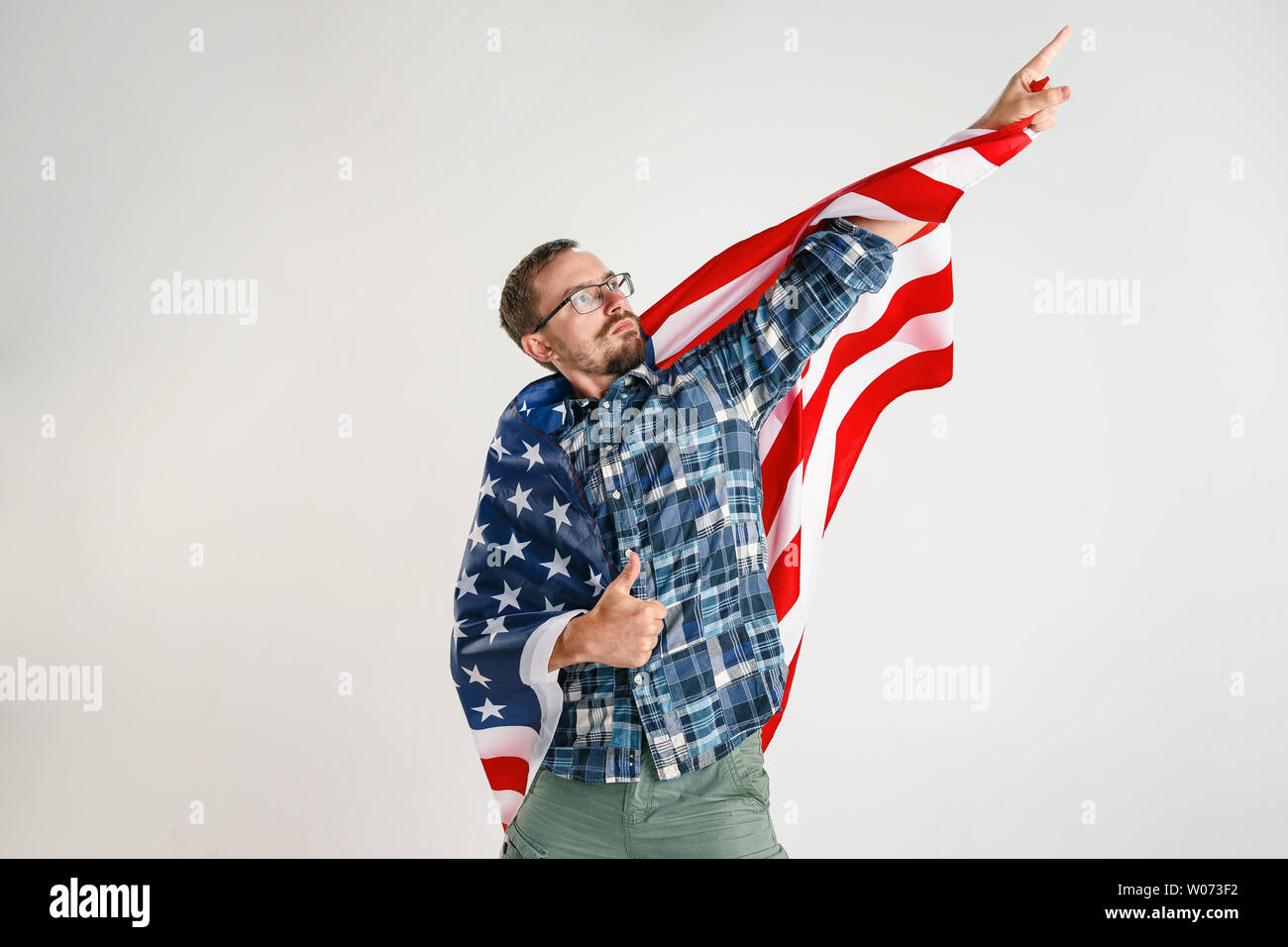 Celebrating an Independence day. Stars and Stripes. Young man with the ...