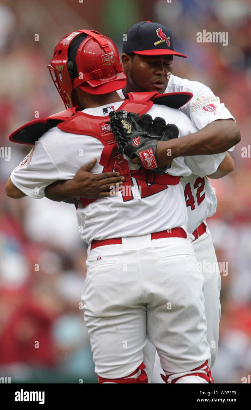 St. Louis Cardinals pitcher Victor Marte gives catcher Tony Cruz a hug ...