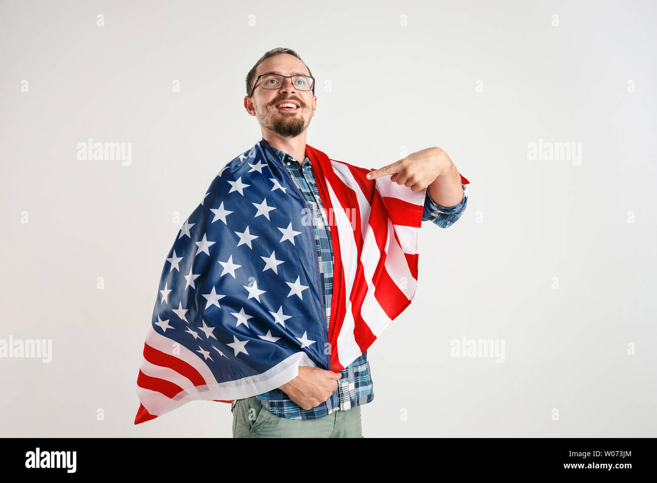 Celebrating an Independence day. Stars and Stripes. Young man with the ...