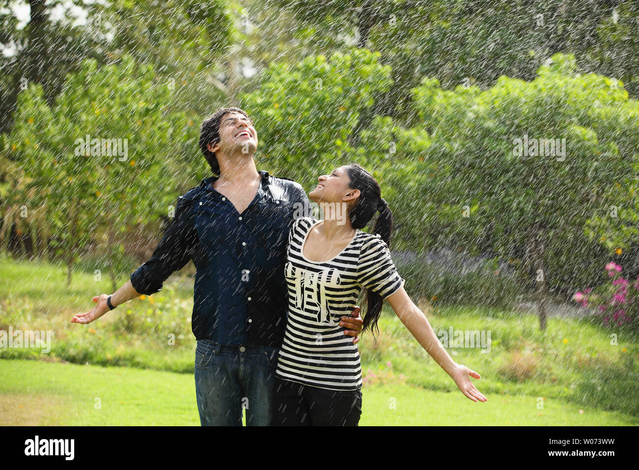 Indian couple enjoying rain hi-res stock photography and images - Alamy
