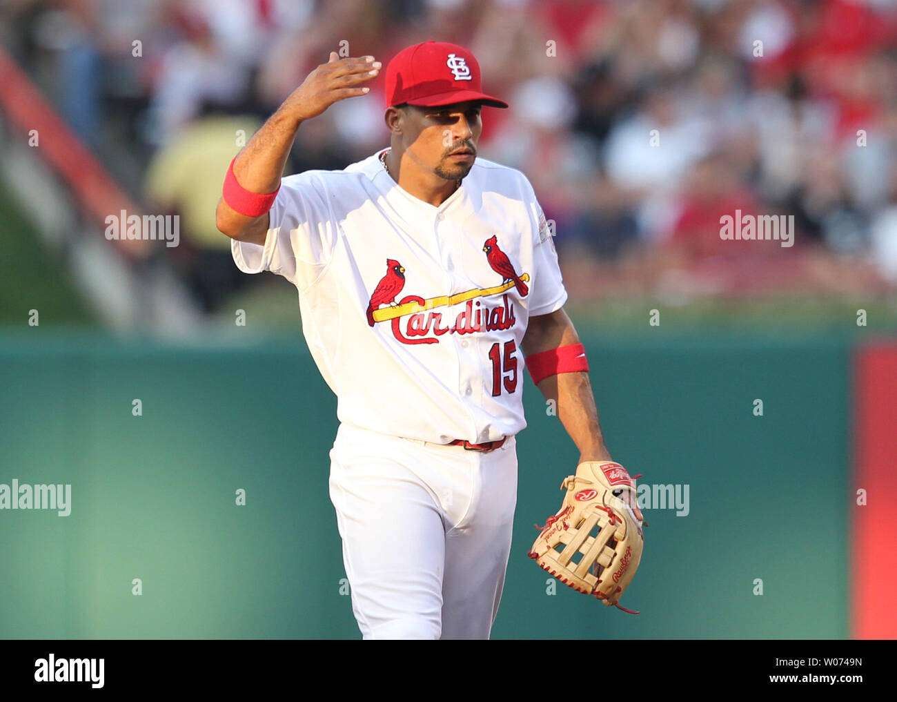 St. Louis Cardinals Rafael Furcal shields his eyes from the sun during ...