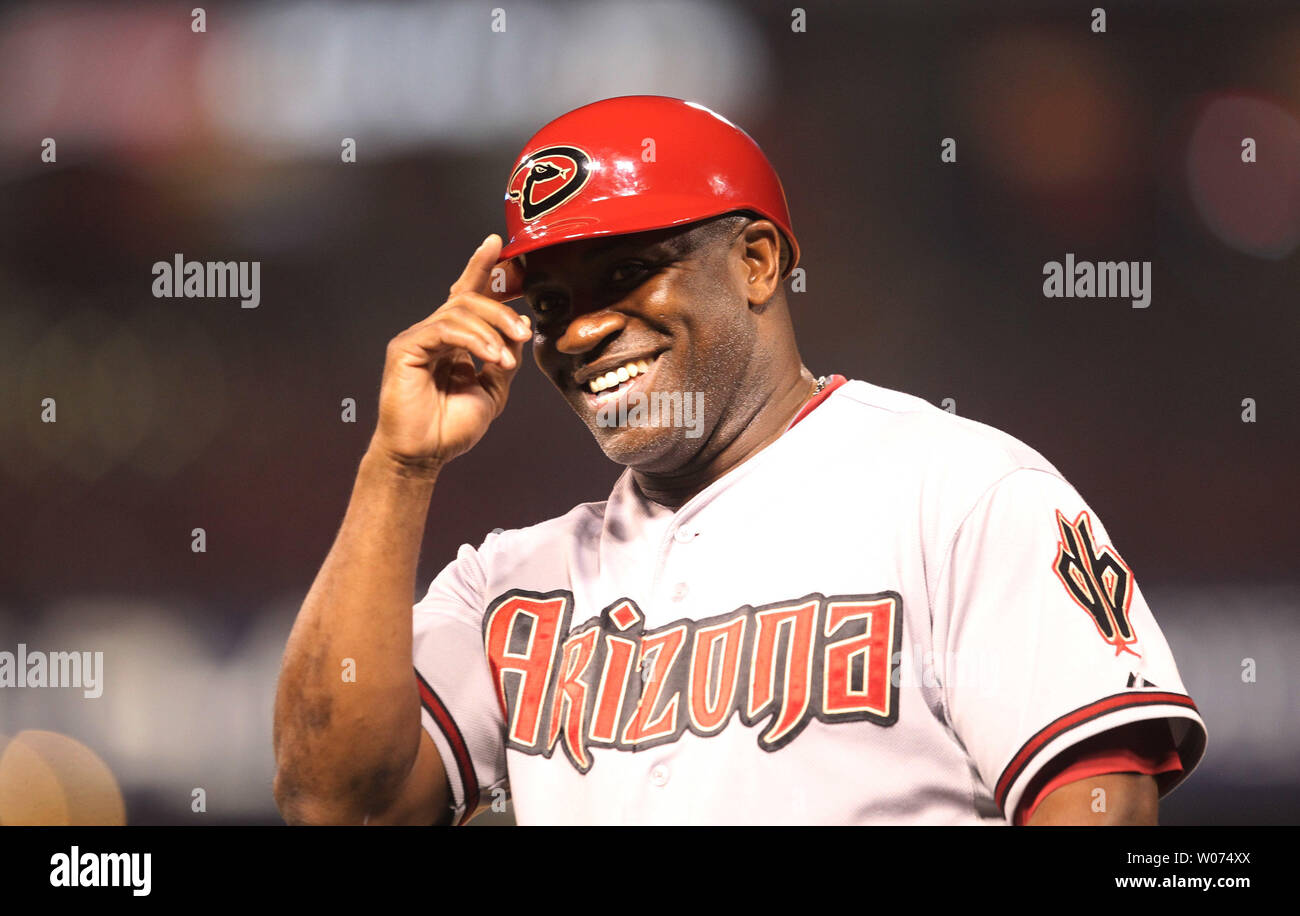 Arizona Diamondbacks first base coach Eric Young says hello to fans in ...