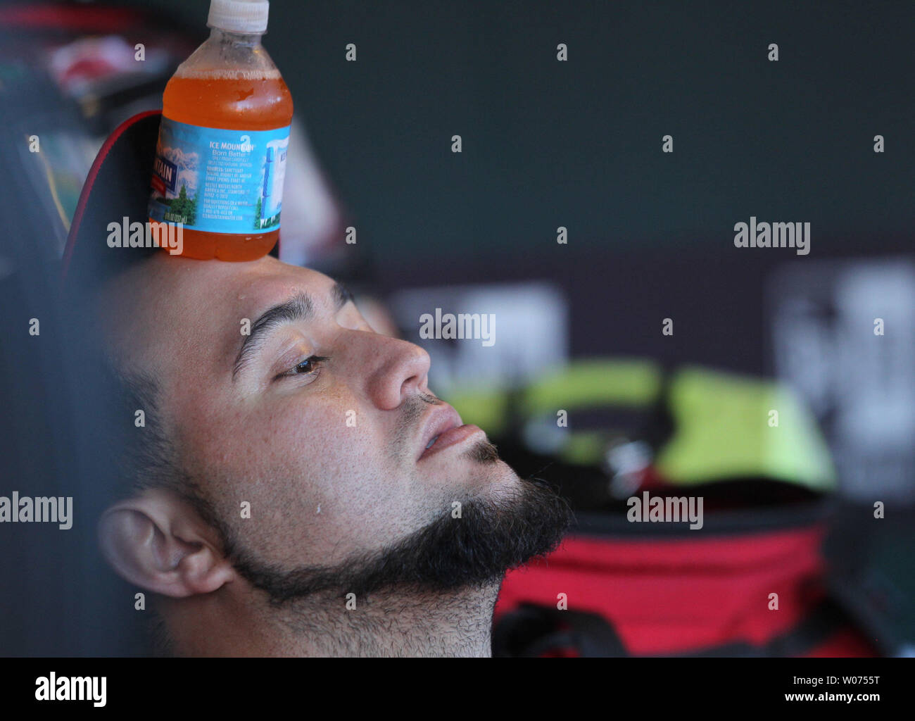 St. Louis Cardinals pitcher Edward Mujica balances an energy drink on ...