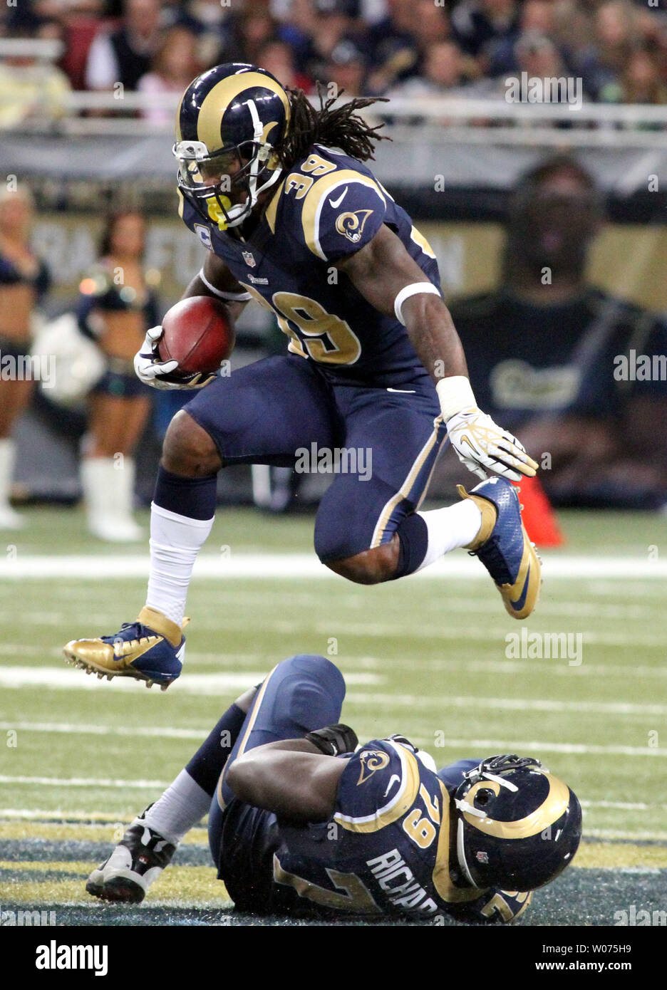 St.Louis Rams Steven Jackson leaps over his lineman in the forth ...