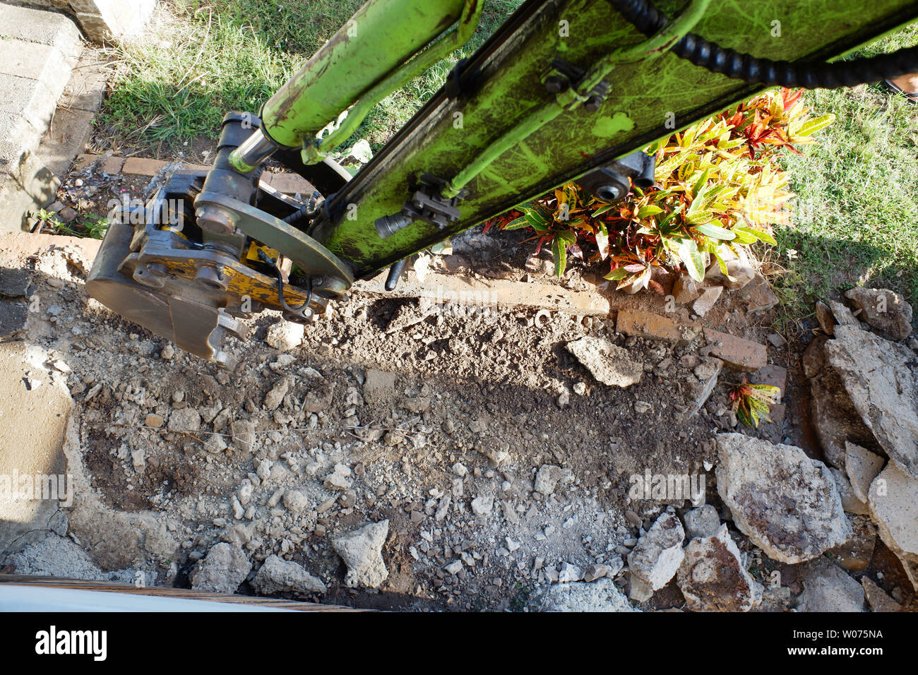EXCAVATOR BREAKING UP CONCRETE Stock Photo - Alamy