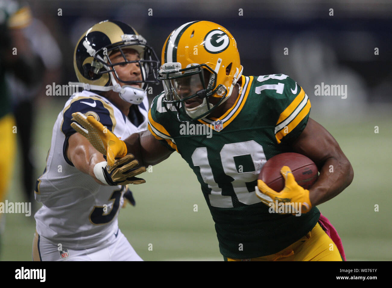 Green Bay Packers Randall Cobb (18) pushes St. Louis Rams Cortland ...