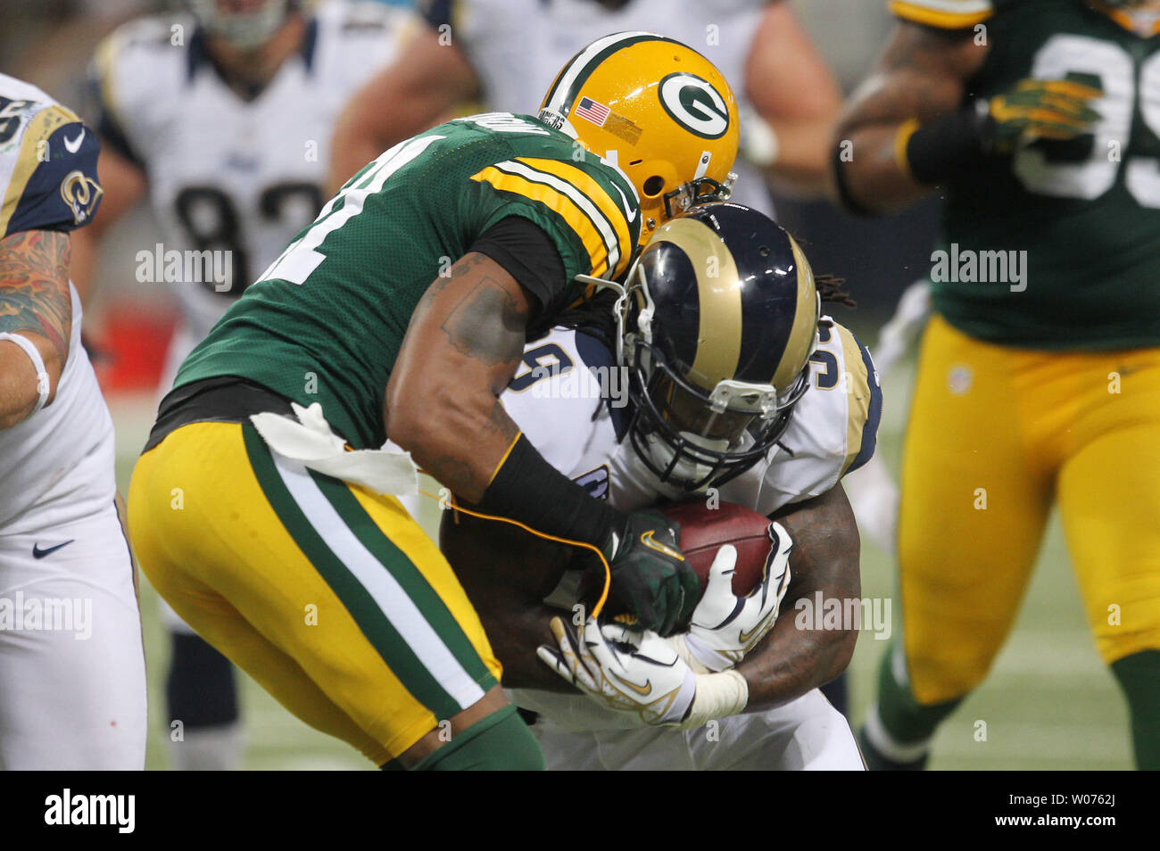 St. Louis Rams Steven Jackson is stopped by Green Bay Packers Charles ...