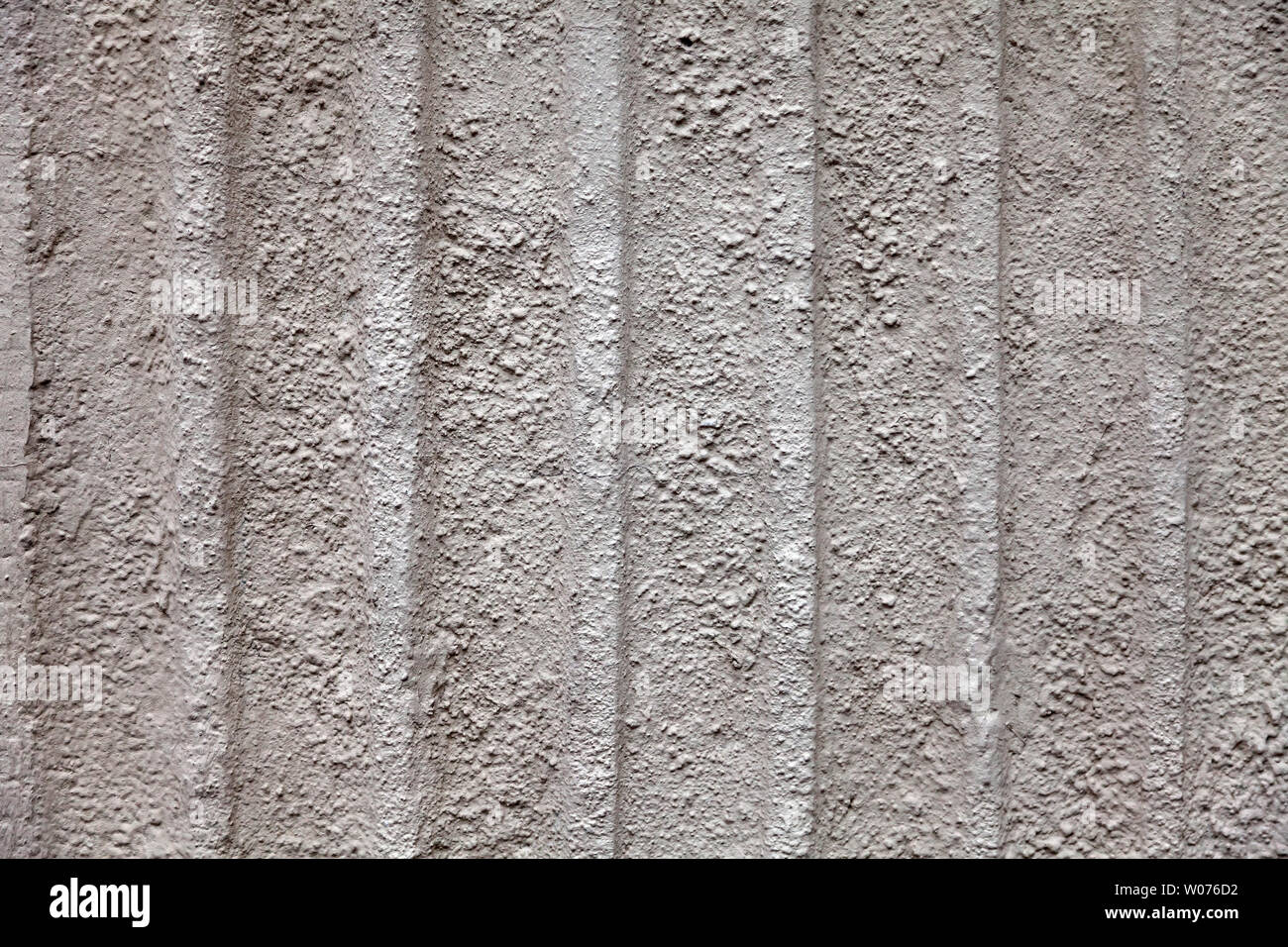 Gray dull background with a rough stone texture with vertical stripes ...