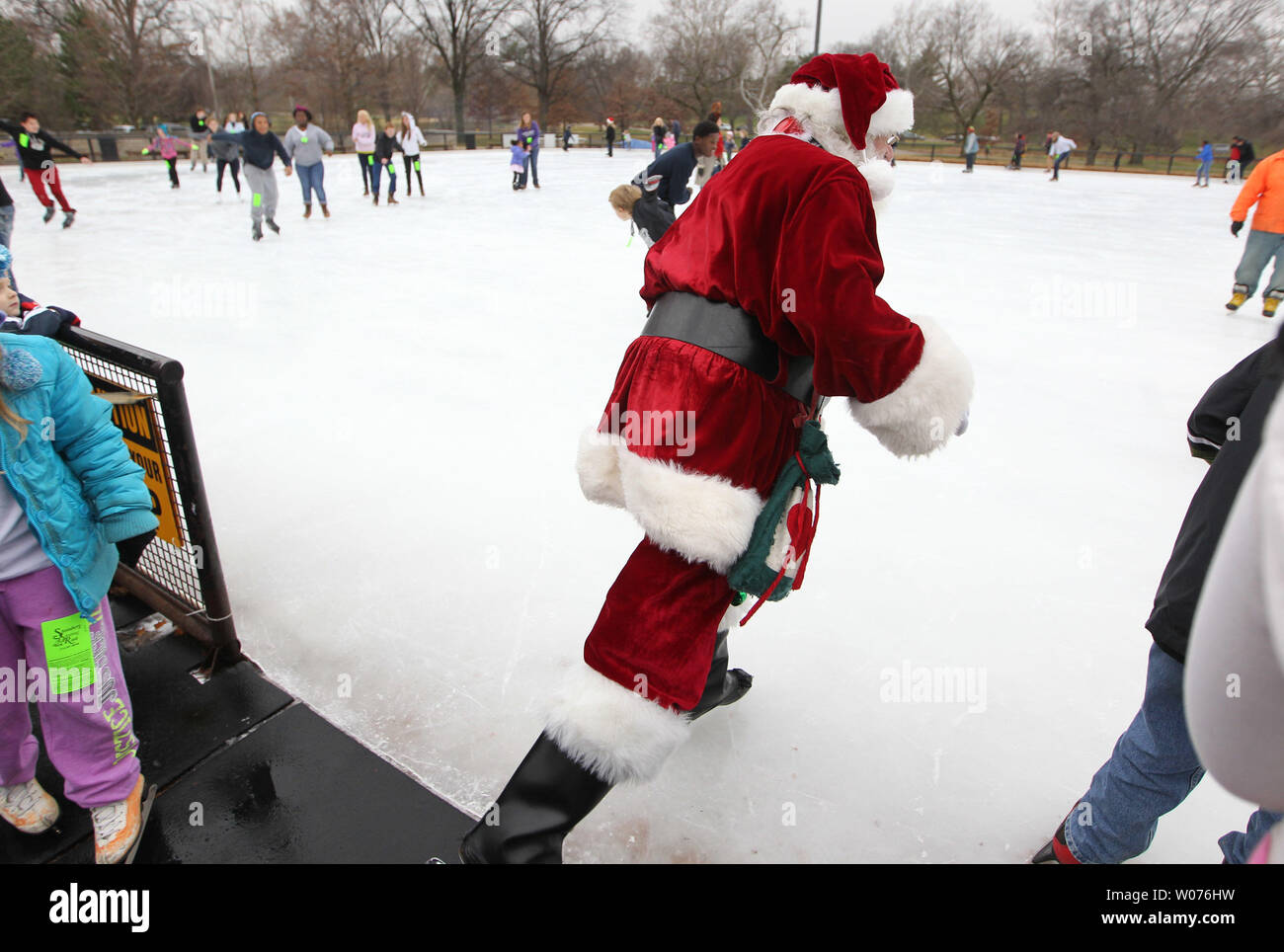 Santa Claus takes to the ice to skate with children at the Steinberg ...