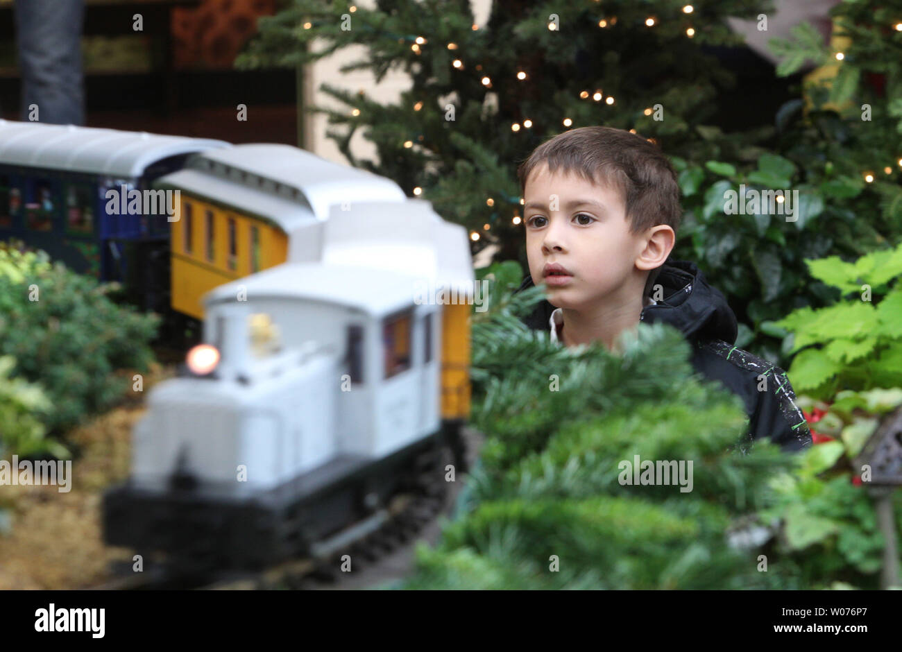 Austin Starkey (4) of St. Louis is amazed at the passing train while ...