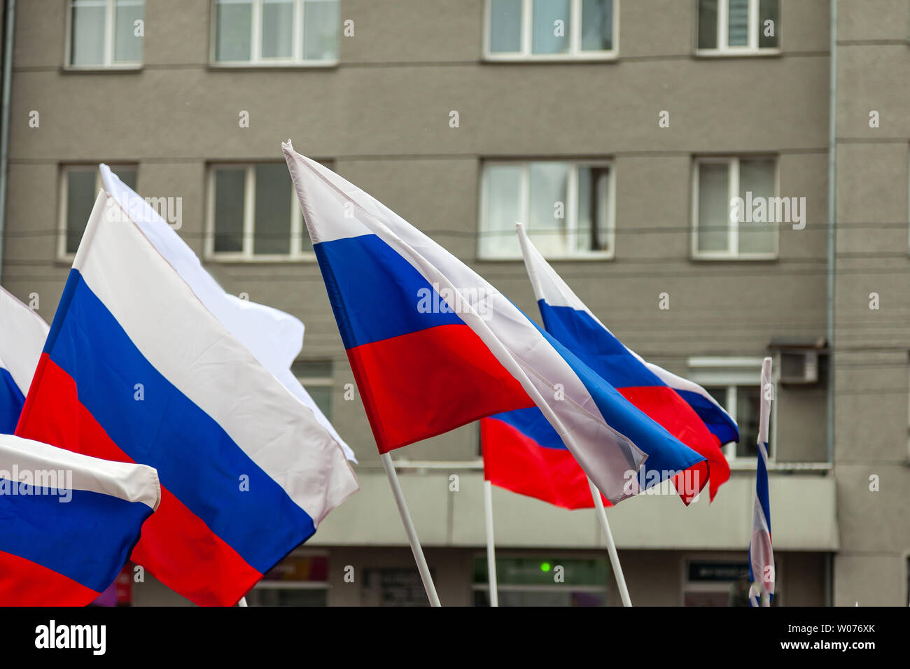 A large number of Russian flags in tricolor with stripes of white, blue ...