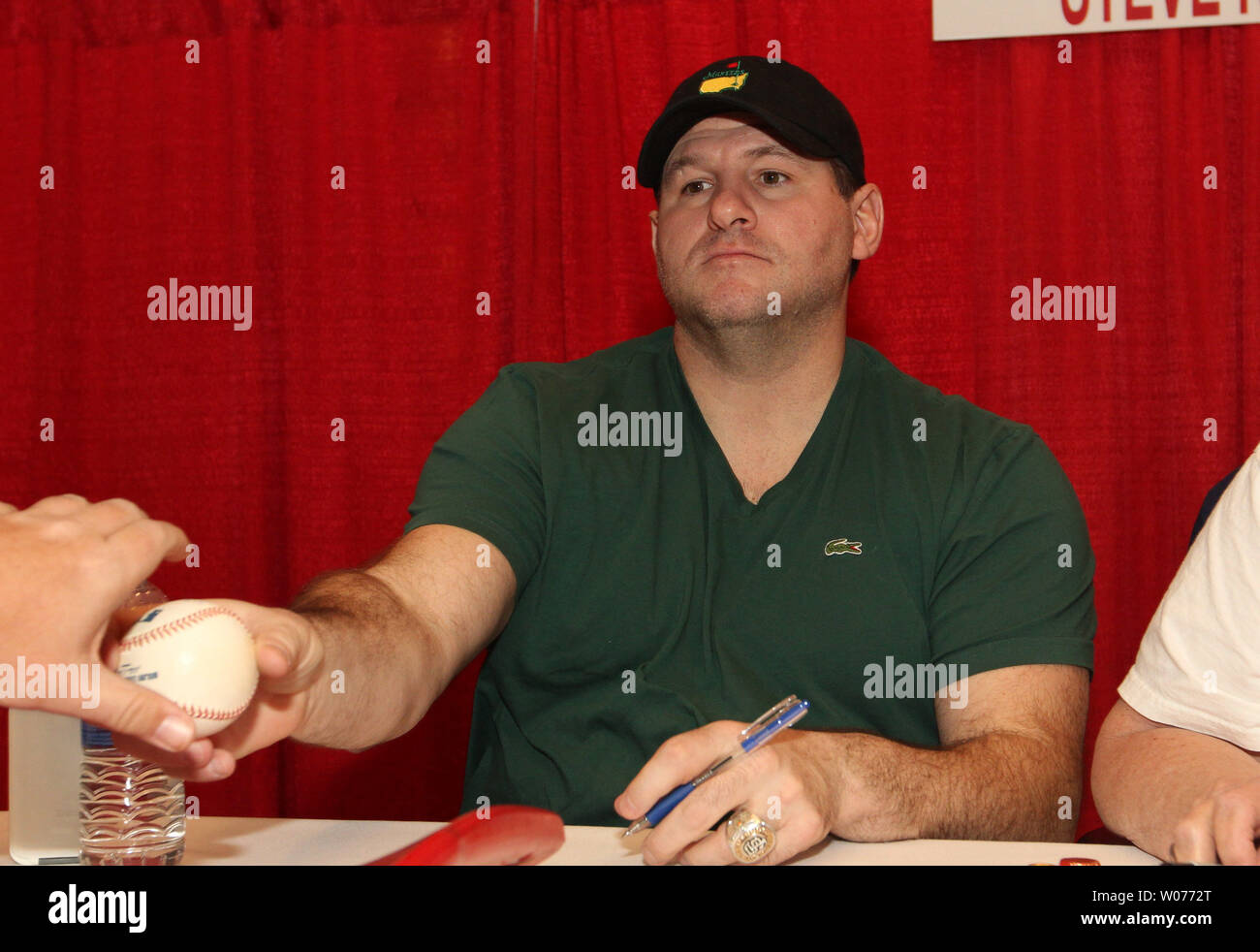 Former St. Louis Cardinals pitcher Steve Kline signs autographs for ...
