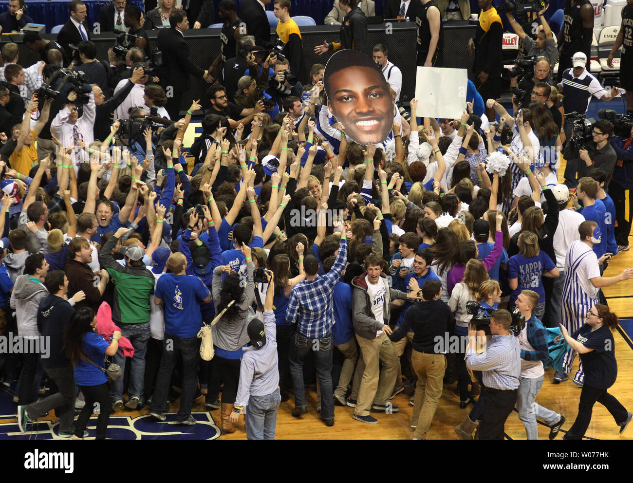 Creighton Blue Jay fans celebrate on the court after winning the ...