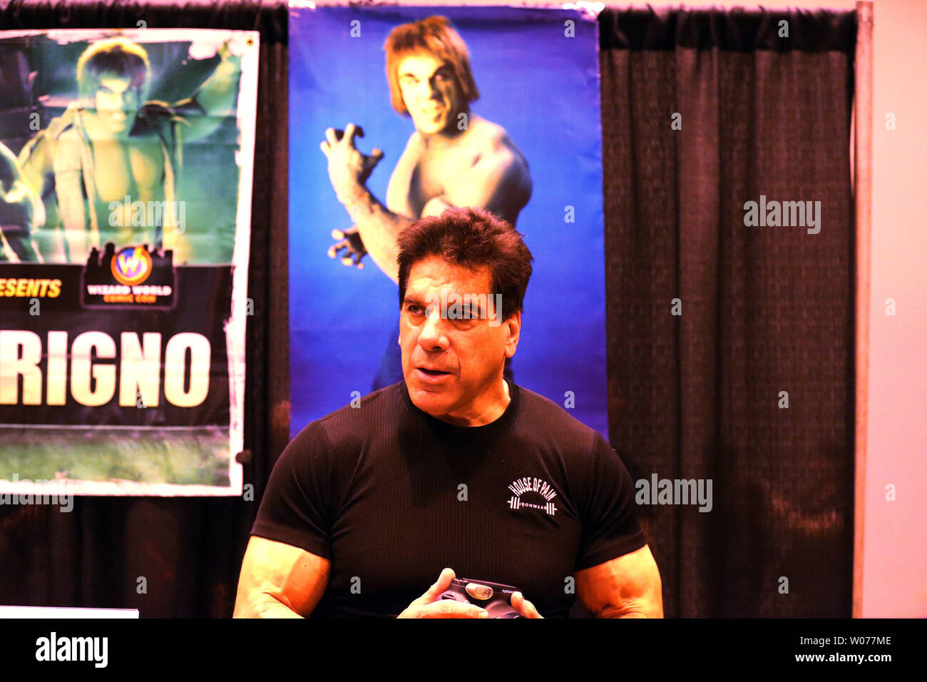 Actor Lou Ferrigno talks with fans as he signs autographs in his booth ...