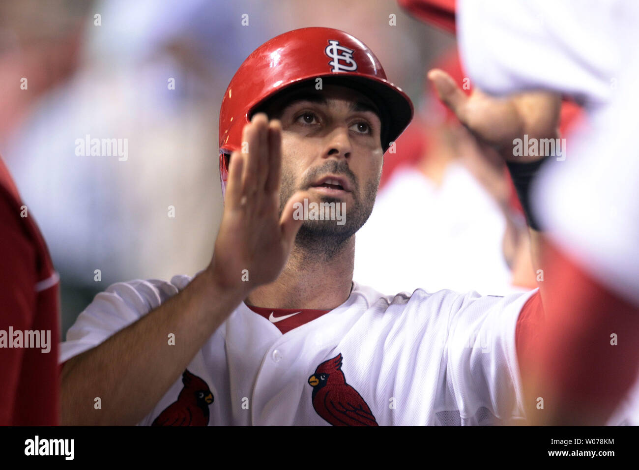 St. Louis Cardinals Daniel Descalso is congratulated in the dugout ...