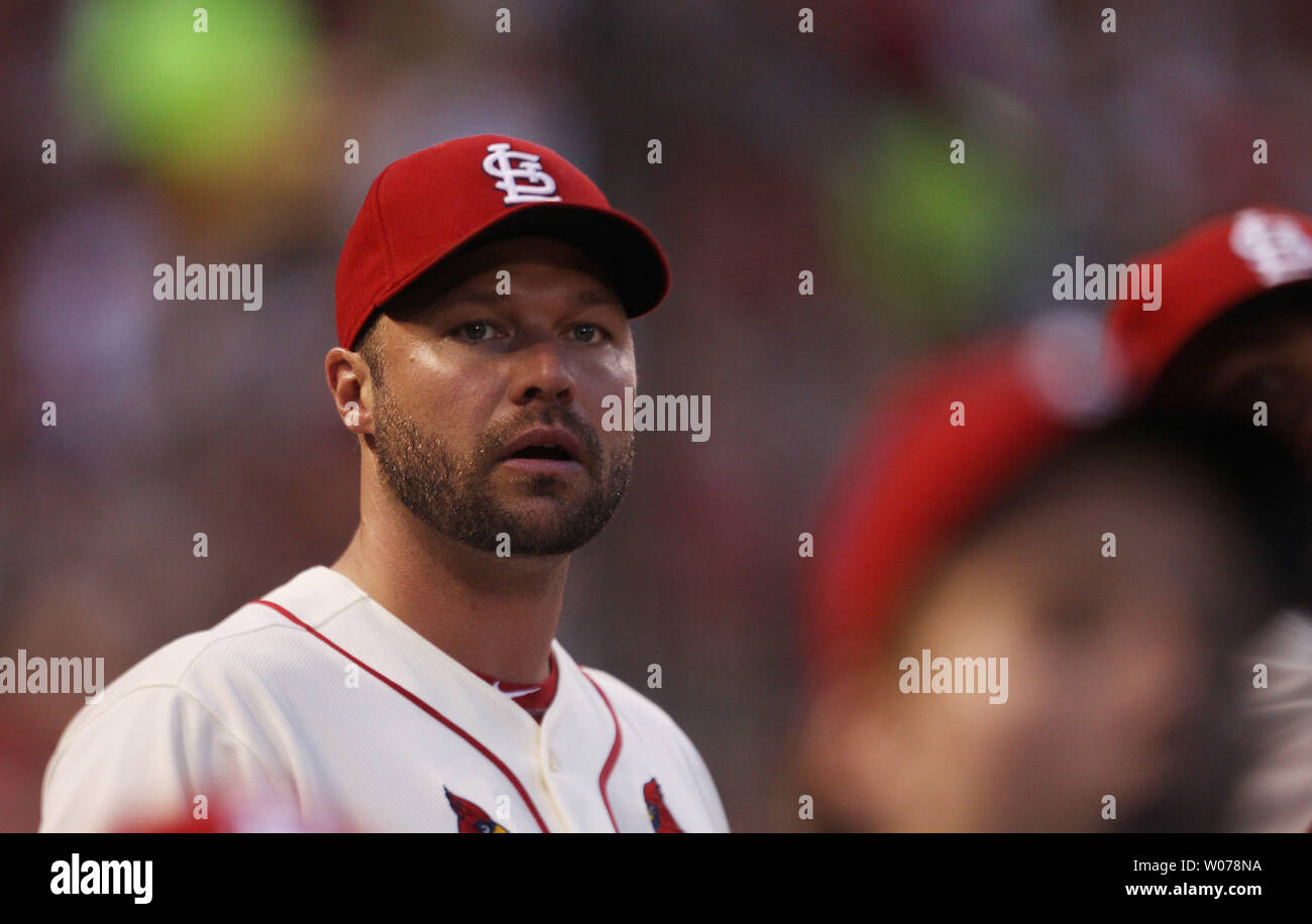 Injured St. Louis Cardinals starting pitcher Jake Westbrook watches the ...