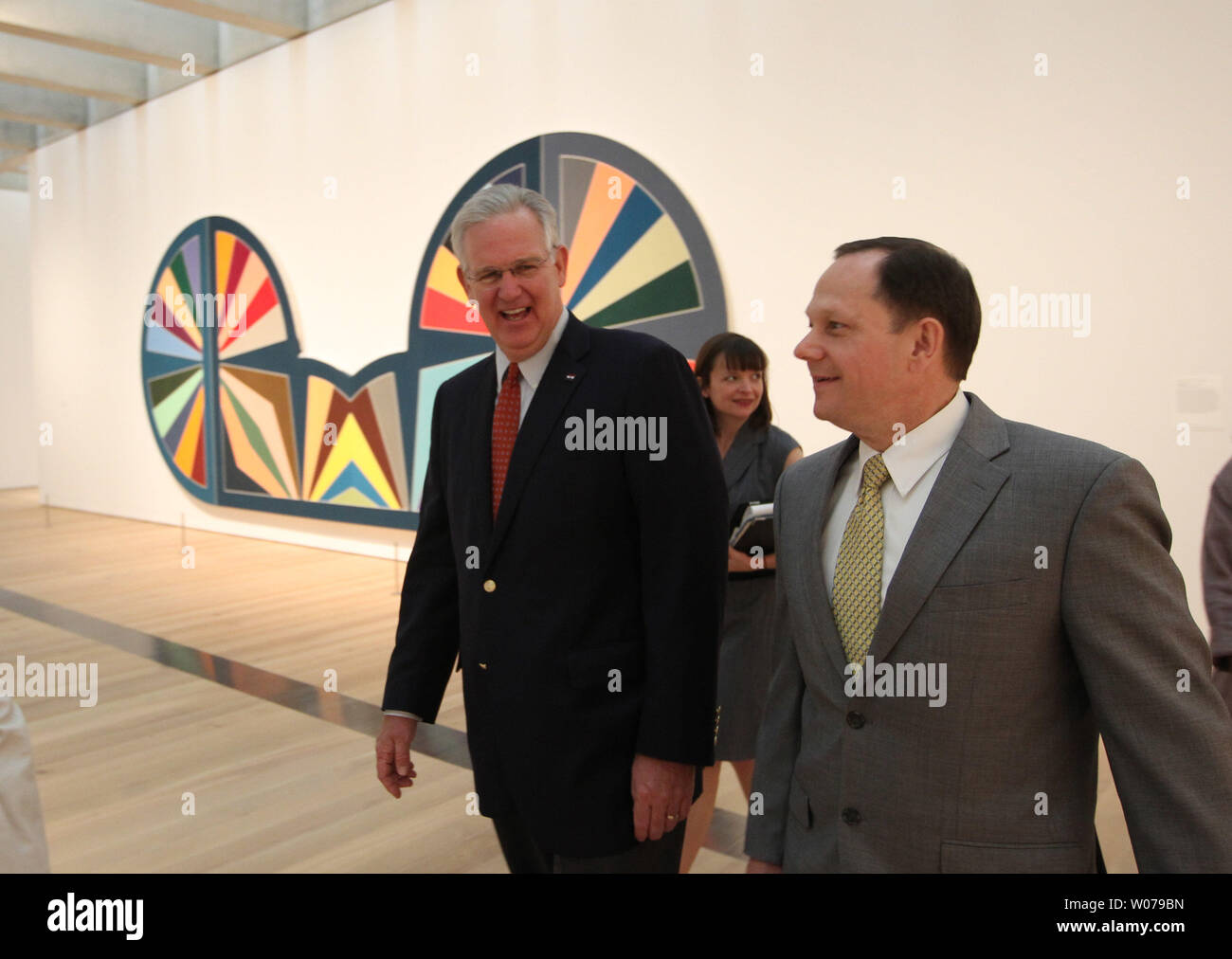 Missouri Governor Jay Nixon (L) and St. Louis Mayor Francis Slay walk ...