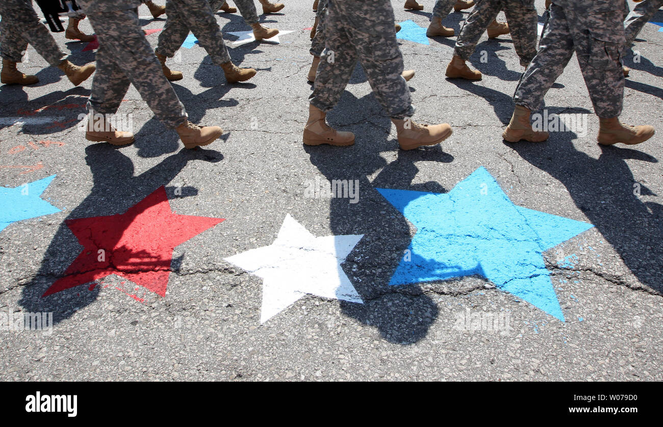 Members of the Army band from Fort Leonard Wood march in a parade ...