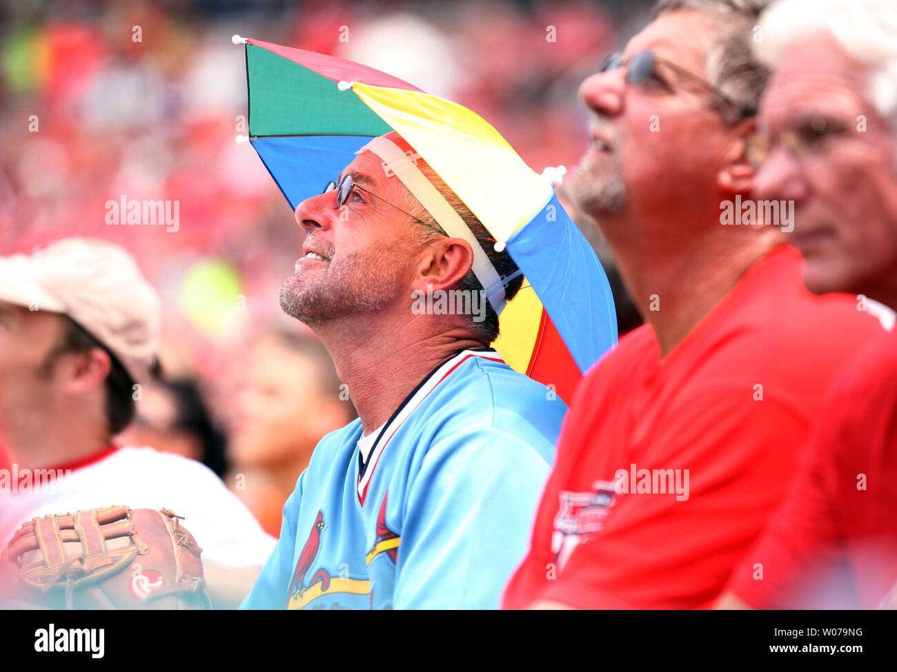 A St. Louis Cardinals fan wears a Brock-A-Brella to fight the sun ...