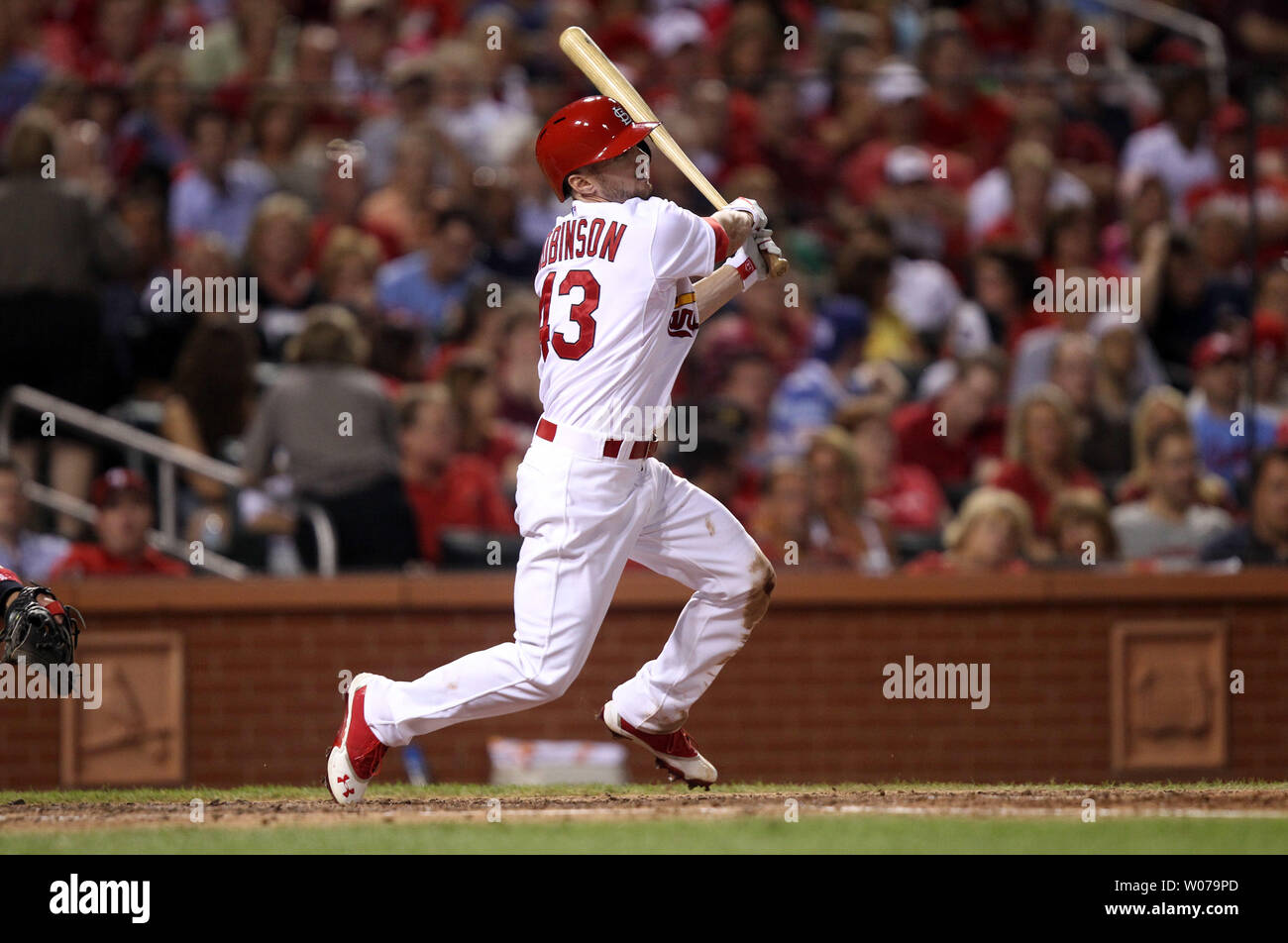St. Louis Cardinals Shane Robinson swings hitting a two RBI triple in ...