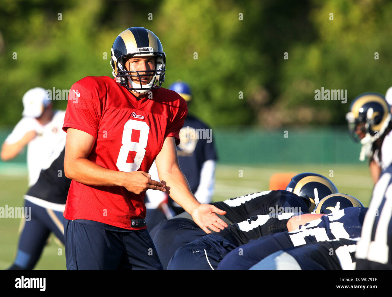 St. Louis Rams quarterback Sam Bradford gives his receivers a signal ...
