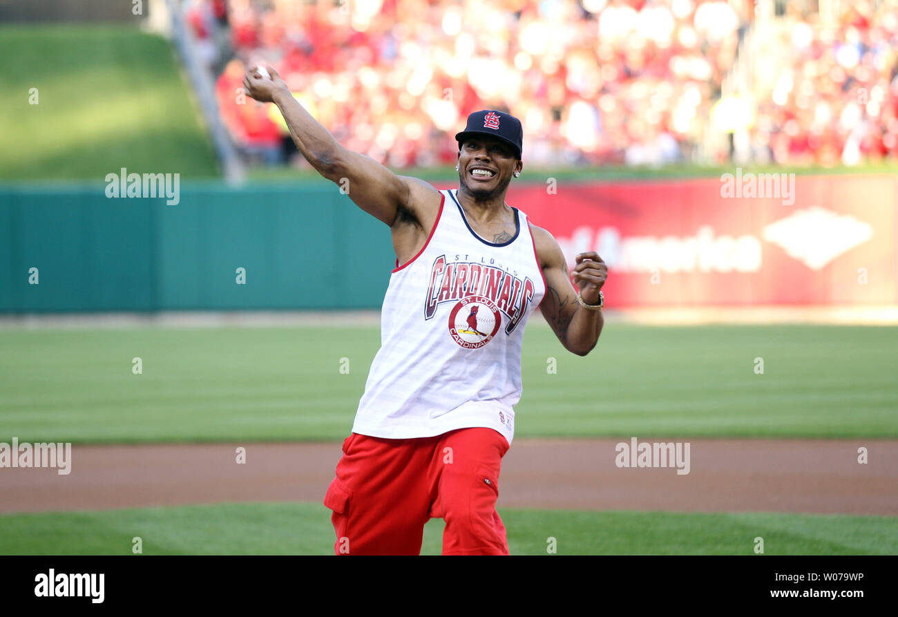 Rapper and St. Louis native Nelly, throws a ceremonial first pitch ...
