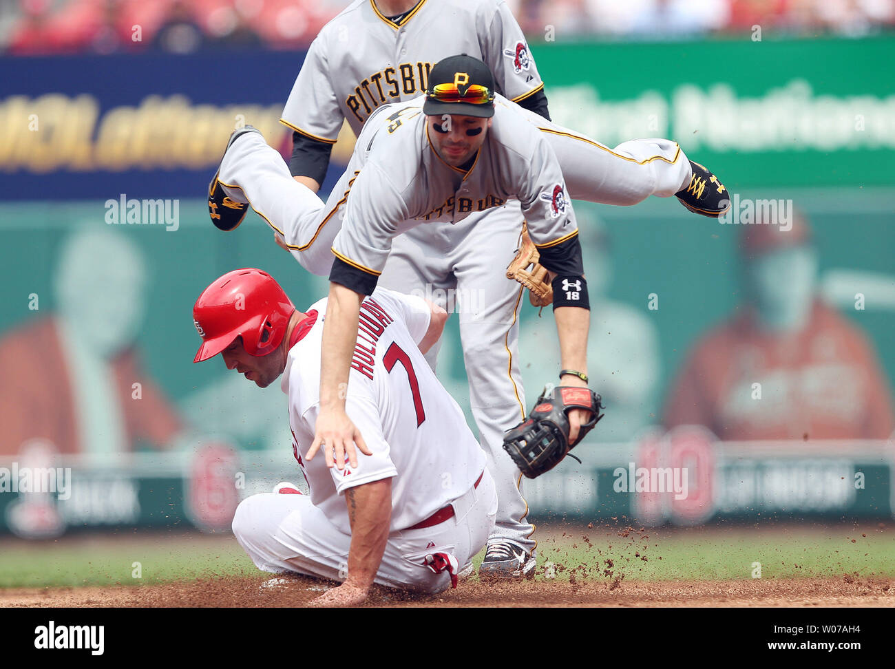 Pittsburgh Pirates second baseman Neil Walker jumps over the sliding St ...