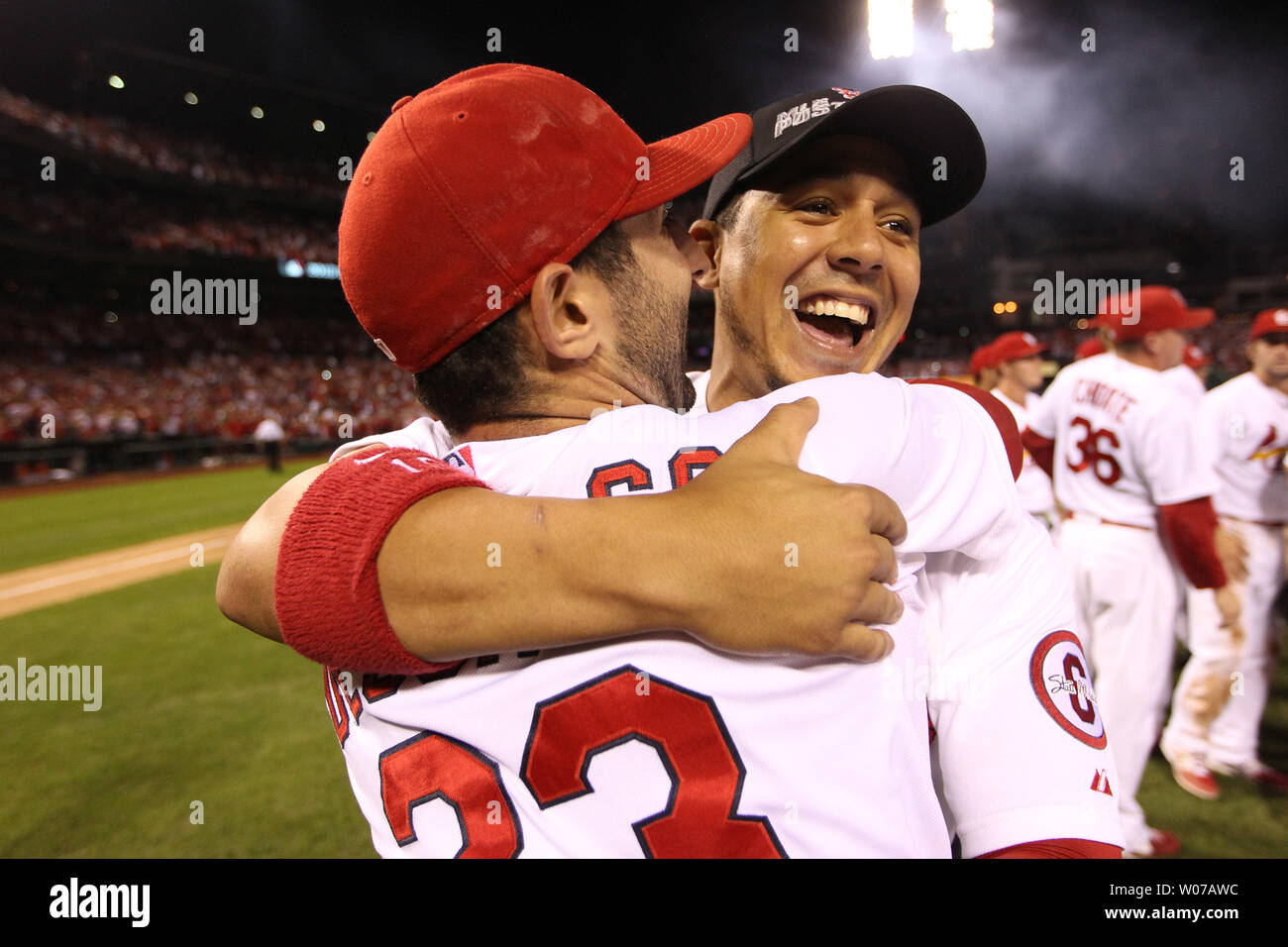 St. Louis Cardinals Jon Jay hugs Daniel Descalso as the team celebrates ...