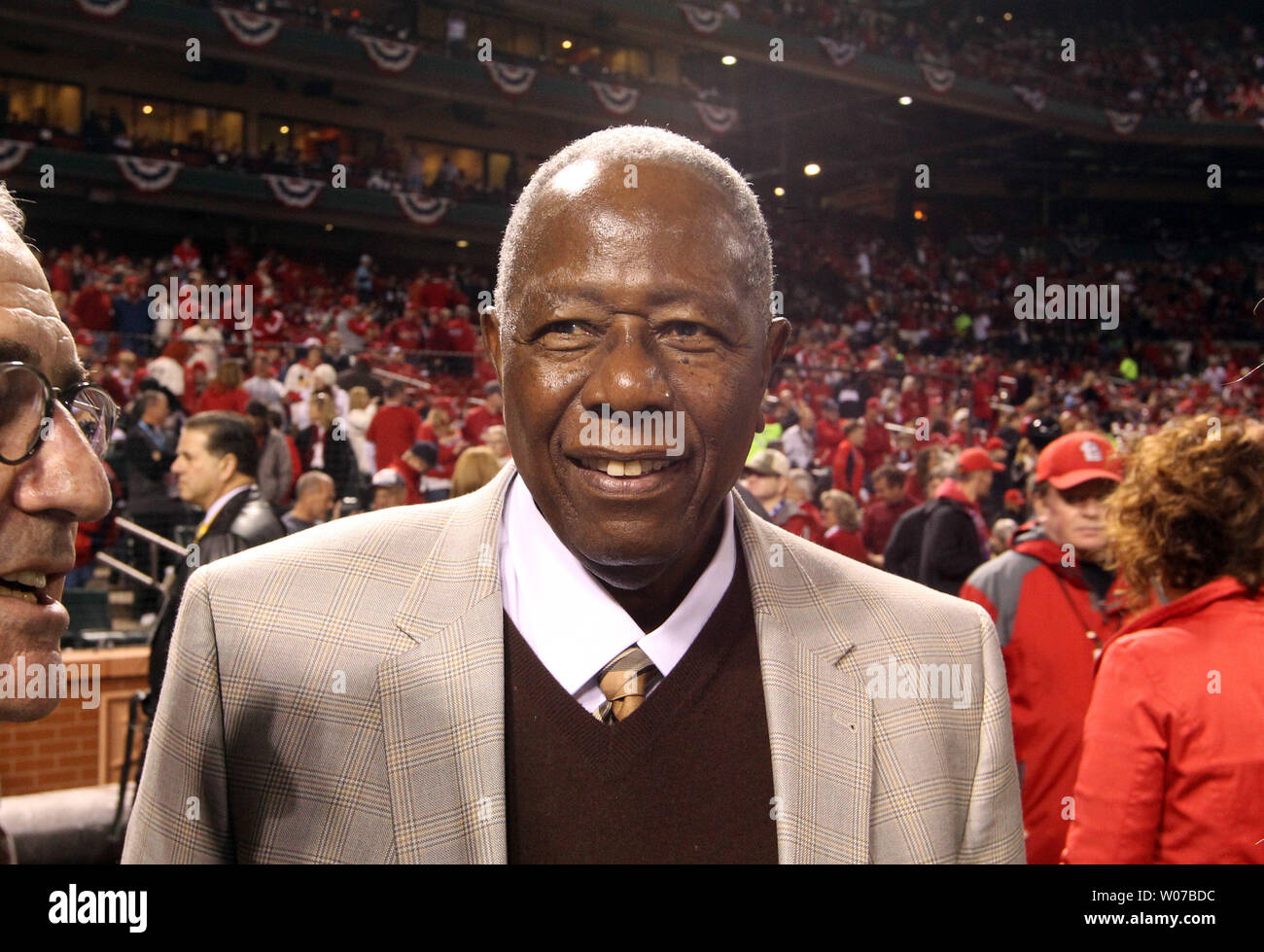 National Baseball Hall of Fame member Henry Aaron waits on the field at ...