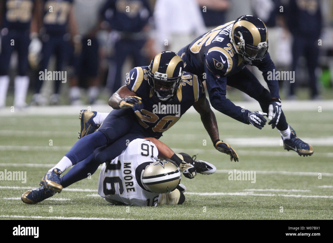 St. Louis Rams Darian Stewart (20) and T.J. McDonald corral New Orleans ...