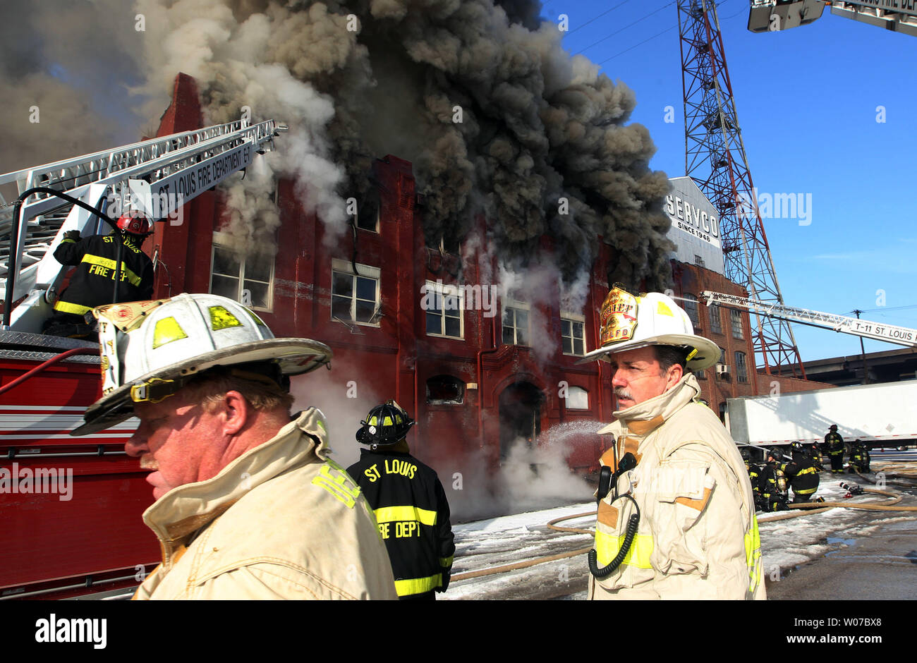 St. Louis fire chief Dennis Jenkerson (R) gives instructions as fire ...