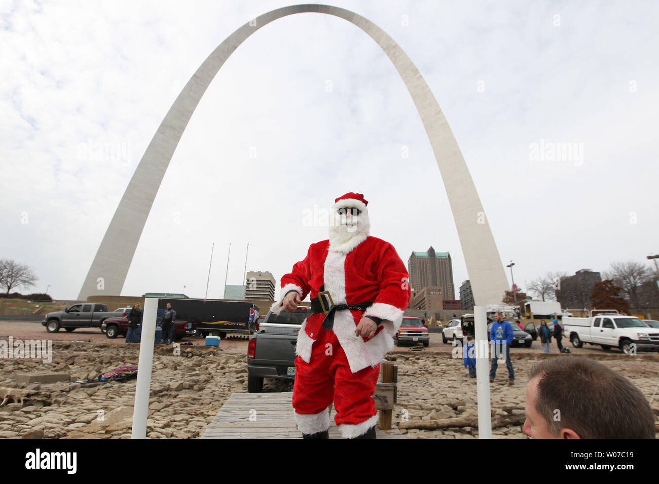 Dave Dietrich, dressed as Santa Claus, walks to the end of the dock ...