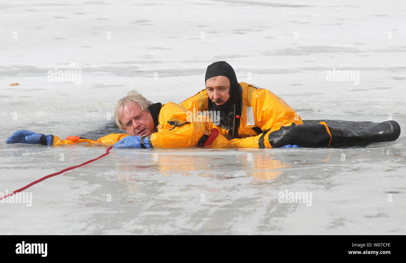 St. Louis Fire Department Rescue Squad 2 member Ruben Micich works to ...