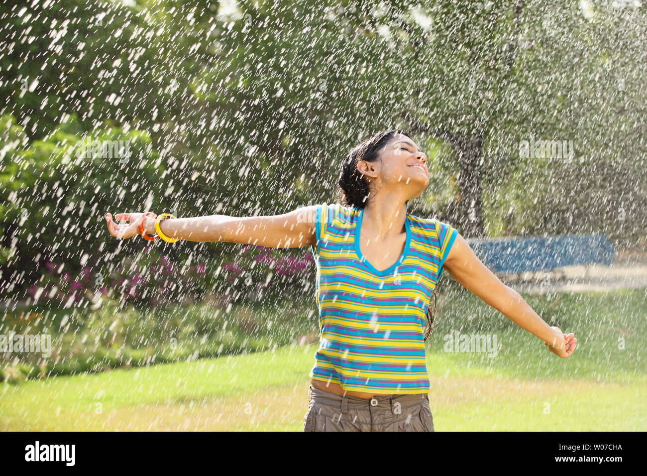 Indian girl enjoying rain hi-res stock photography and images - Alamy