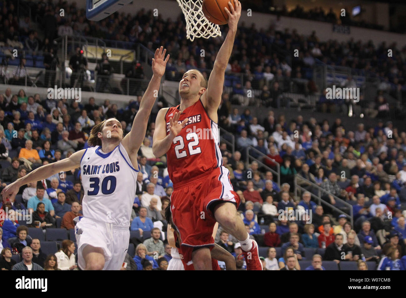 Duquesne Dukes Micah Mason gets past Saint Louis University Billikens ...
